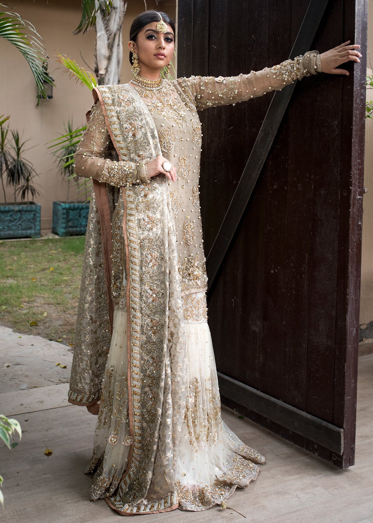 White gharara dress with elegant pearl and sequins work – Nameera by Farooq